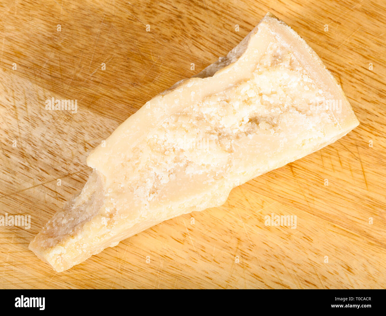 top view of piece of local italian Parmigiano Reggiano (Parmesan) hard ...