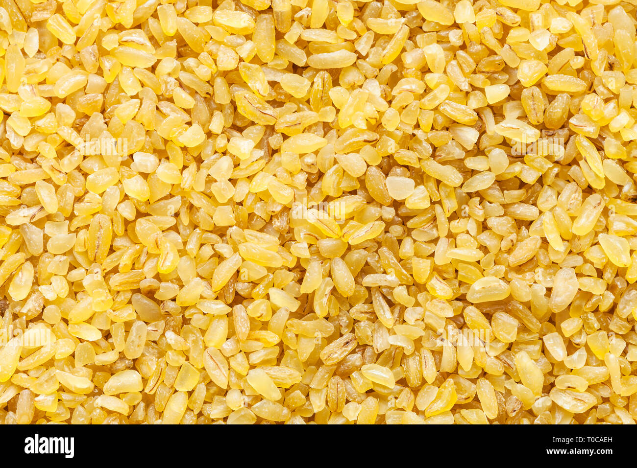 food background - bulgur (burghul), parboiled, dried and crushed wheat ...