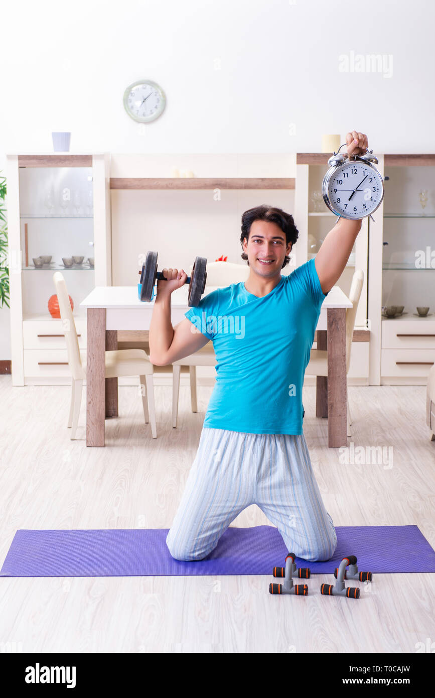 Young handsome man doing morning exercises Stock Photo - Alamy