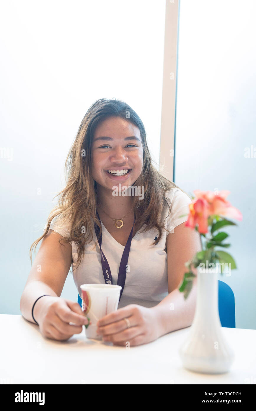 Portrait of an international student on the college campus / grounds ...