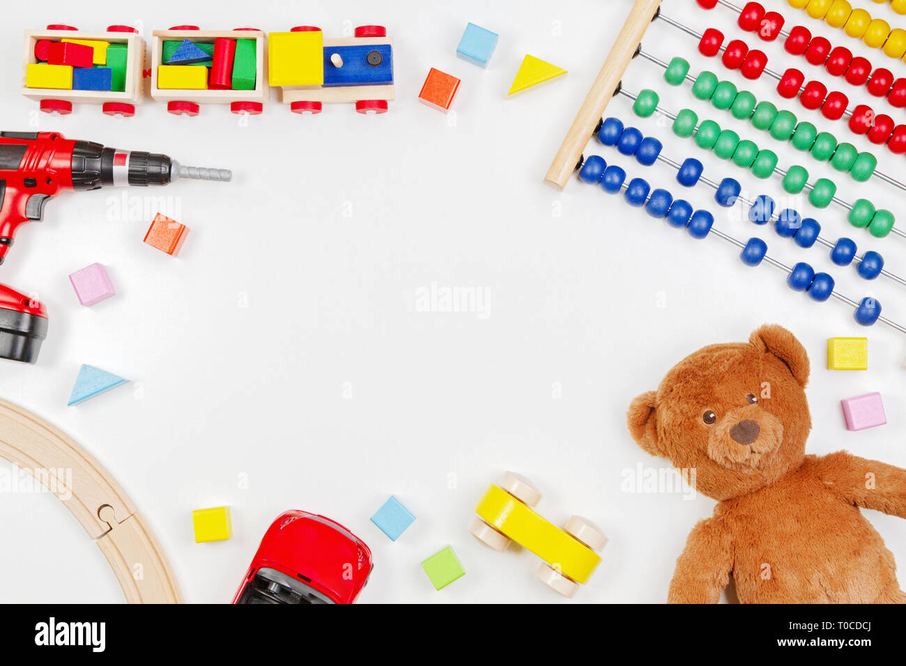 Baby kids toys background with teddy bear, toy tools, wooden train ...