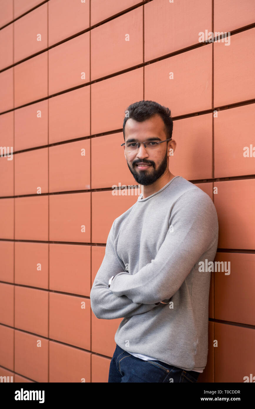 Portrait of an international student on the college campus / grounds ...