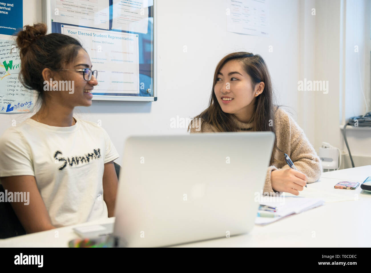 pupils and students in a classroom at a college / university, being ...