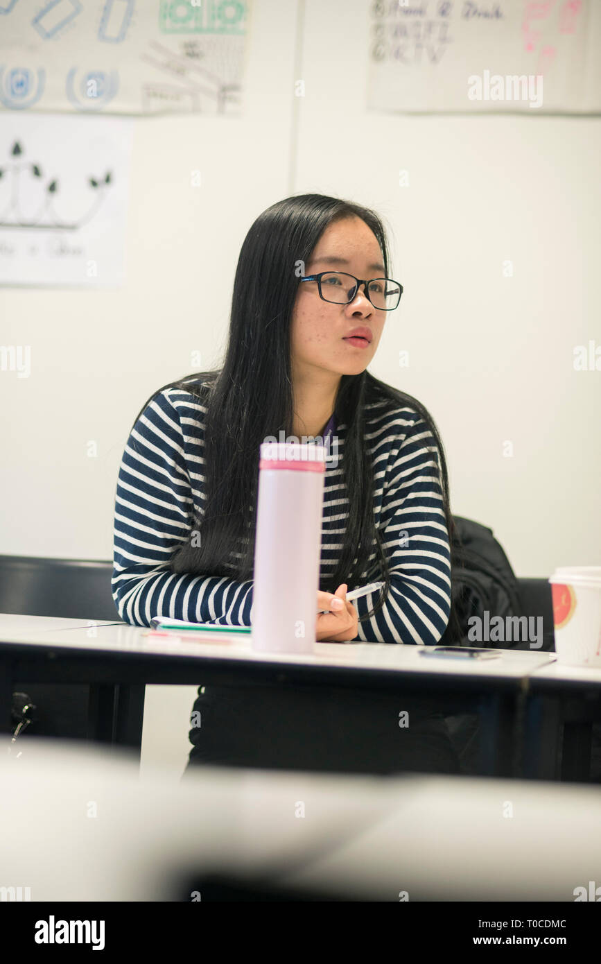 Portrait of an international student on the college campus / grounds ...
