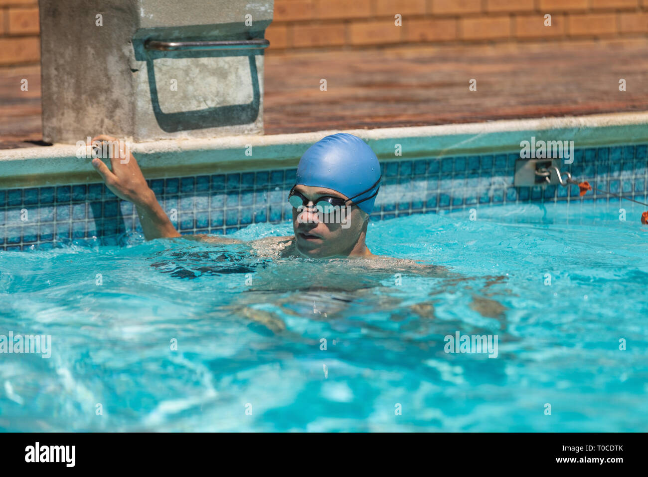 Young Caucasian male swimmer standing in swimming pool Stock Photo - Alamy