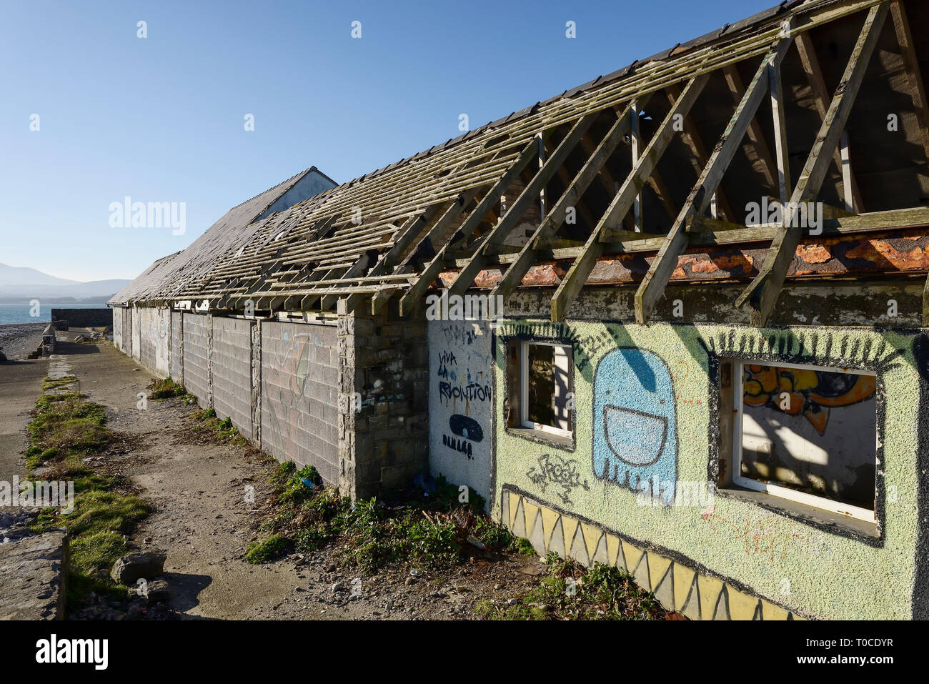 The abandoned and ruined building for the lido and swimming pool on the ...