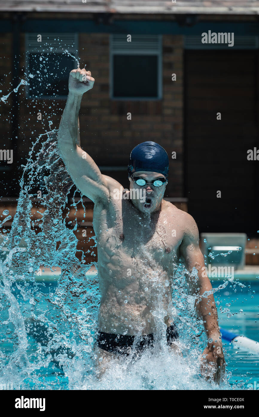 Young swimmer celebrate victory in swimming pool Stock Photo - Alamy