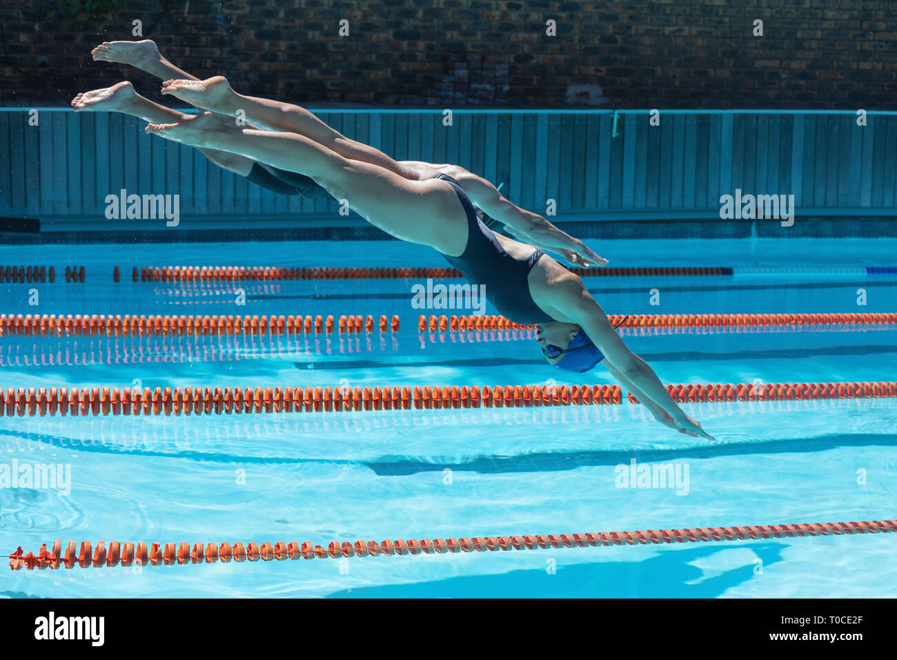 Young Women And Jumping Into Pool High Resolution Stock Photography and ...