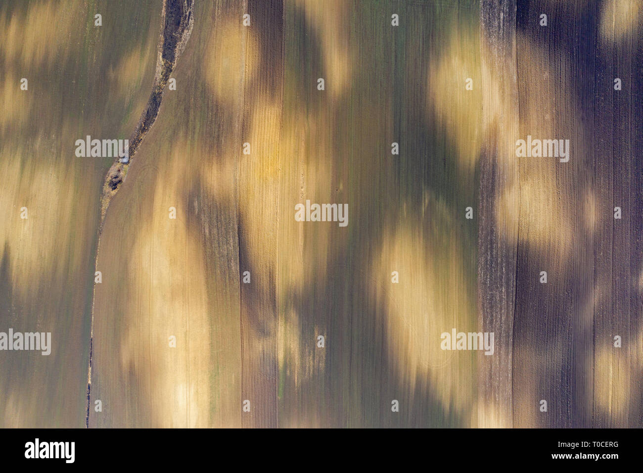Aerial view of agricultural lands, natural pattern of plowed terrain ...