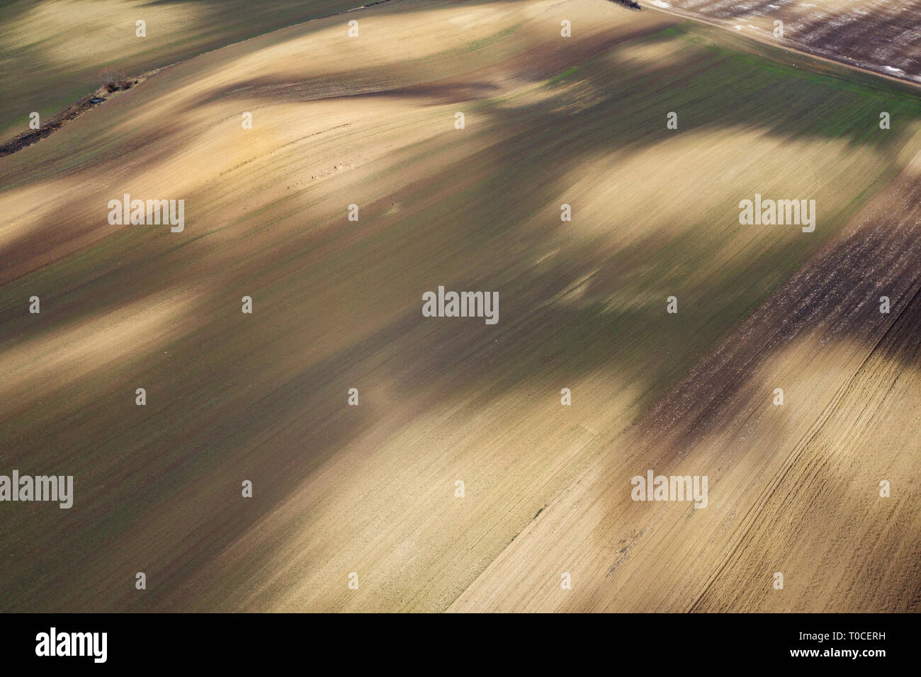 Aerial view of agricultural lands, natural pattern of plowed terrain ...