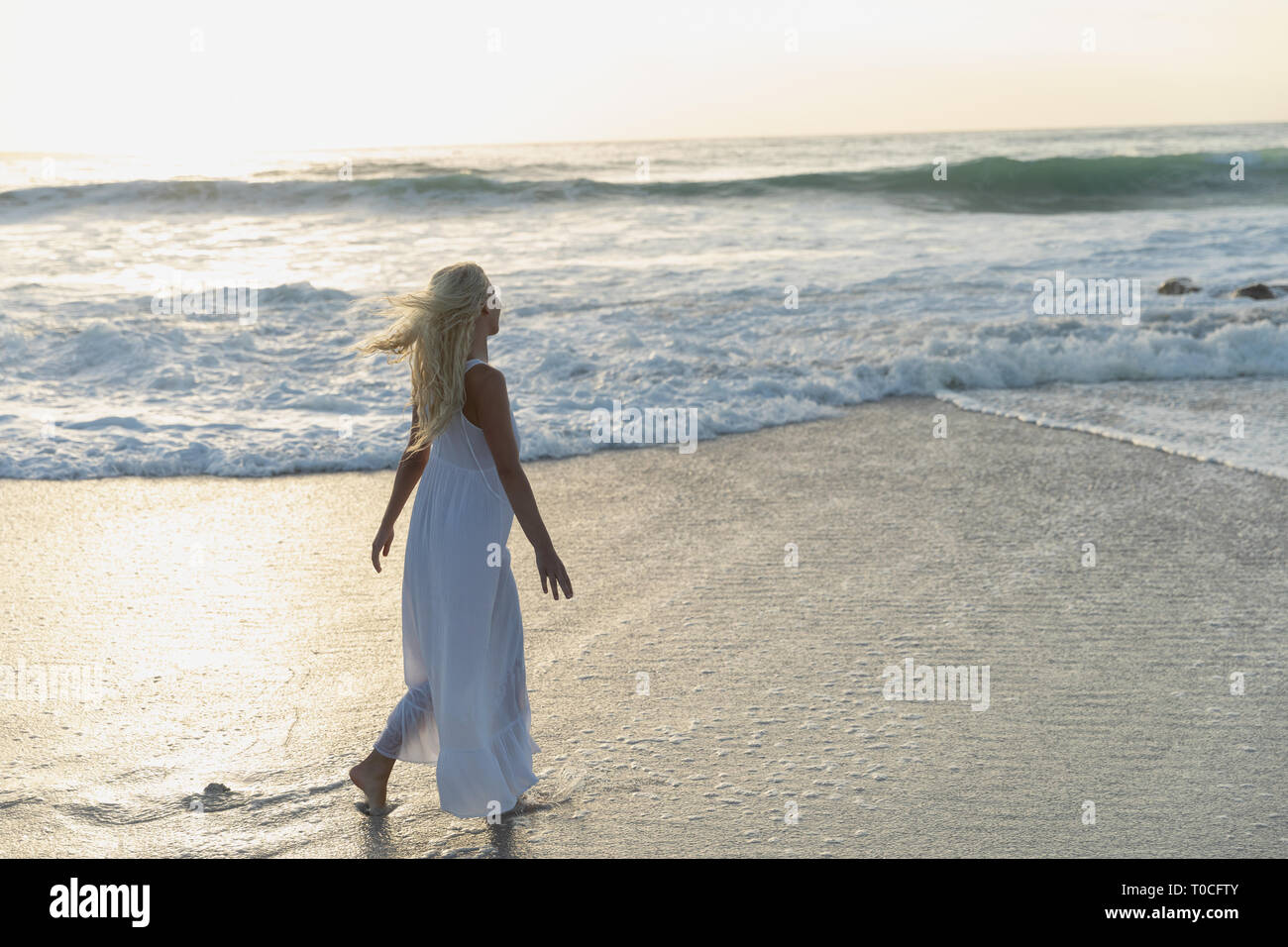 Beautiful woman walking on beach hi-res stock photography and images ...