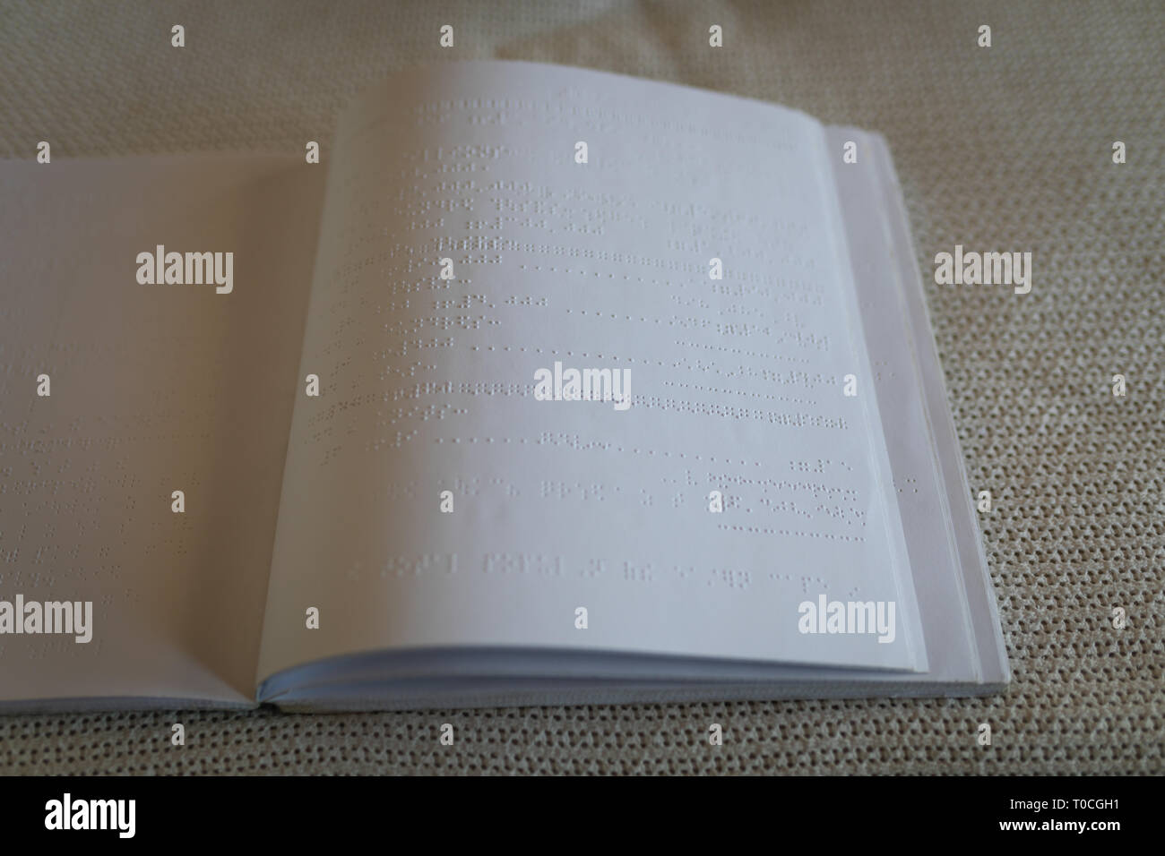 Braille book on bed in bedroom at home Stock Photo - Alamy