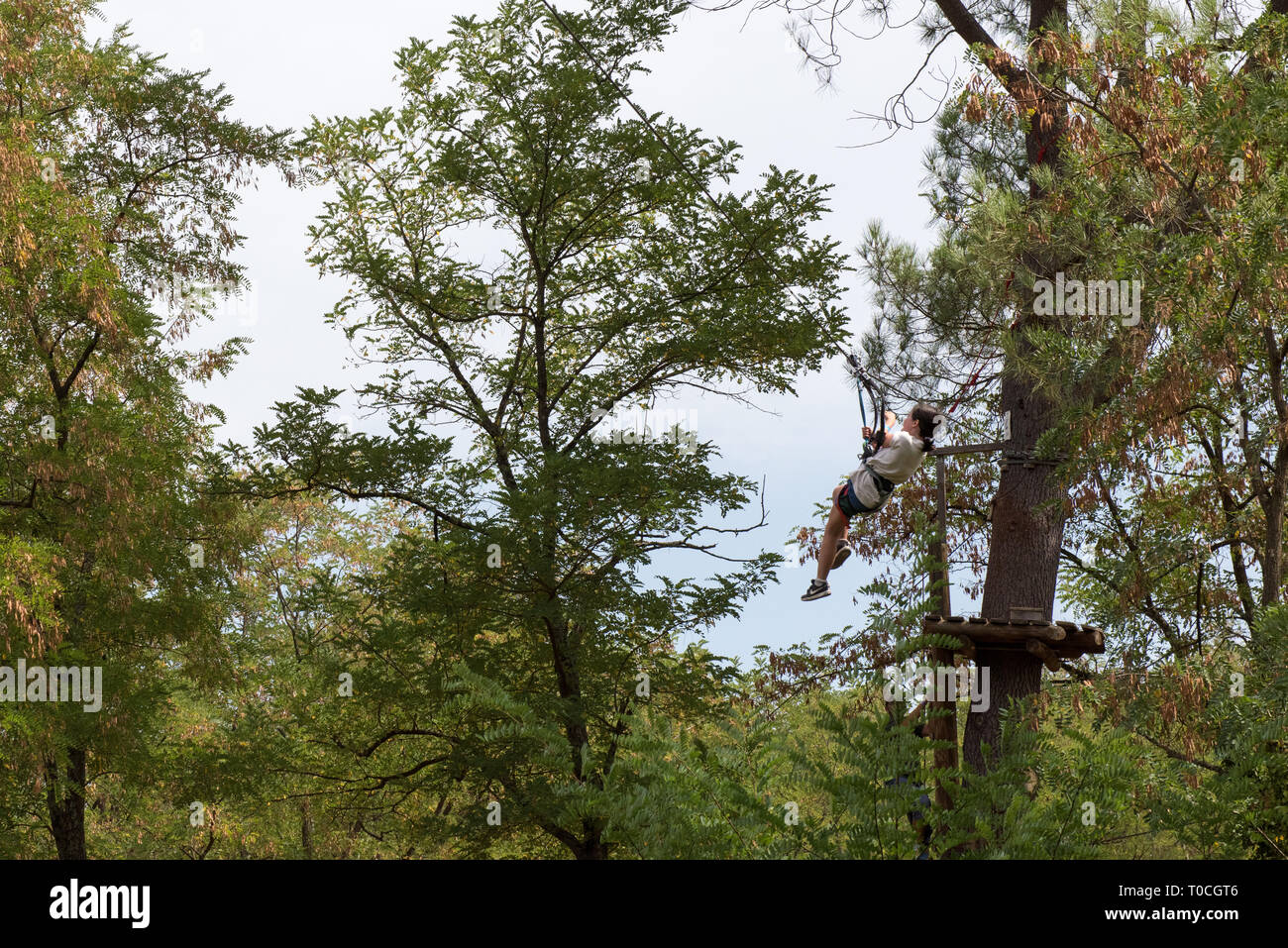Girl ziplining hi-res stock photography and images - Alamy