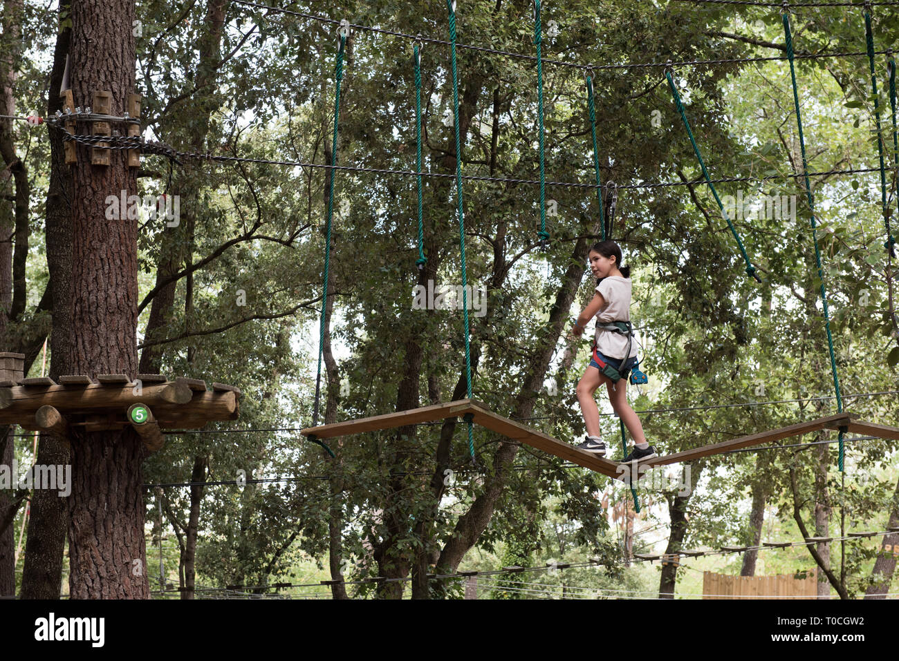 Girl ziplining hi-res stock photography and images - Alamy