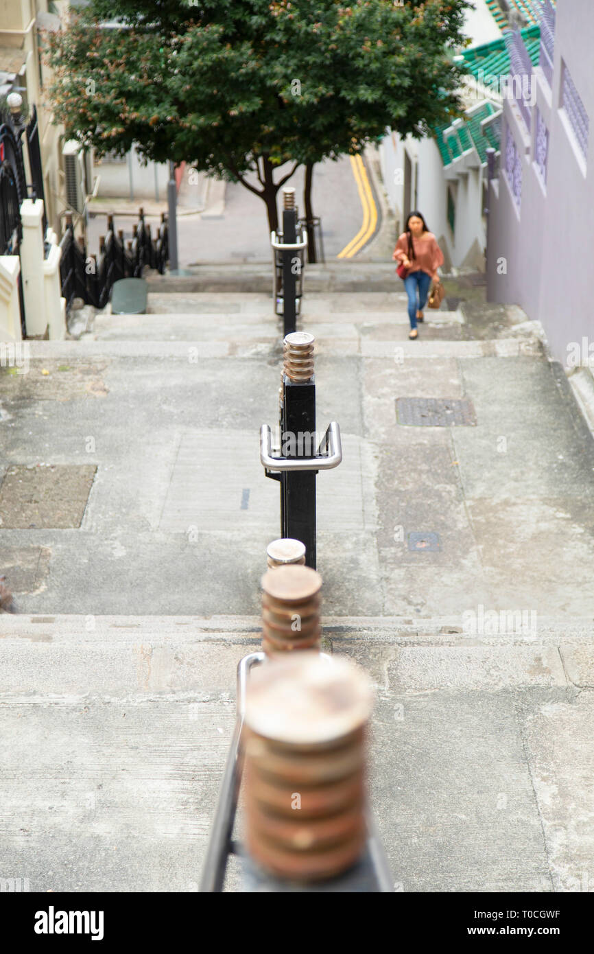 Woman walking up Ladder Street, Sheung Wan, Hong Kong Island, Hong Kong ...