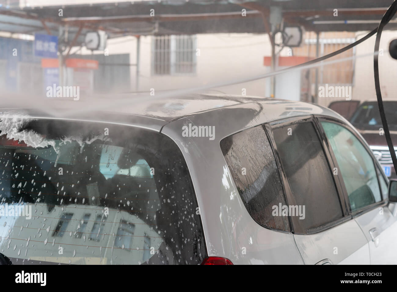 washing a car with soapy liquid Stock Photo - Alamy