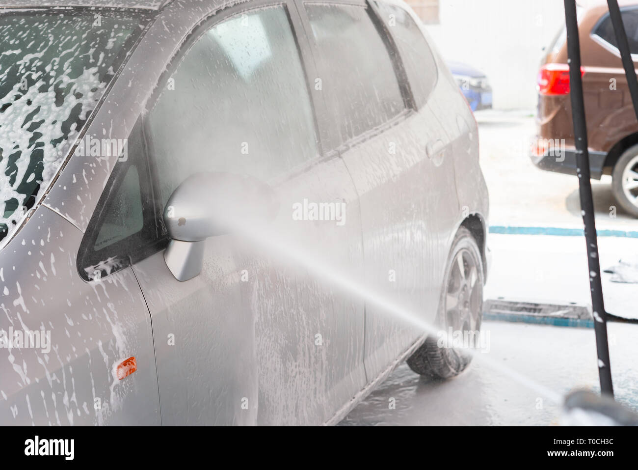 washing a car with soapy liquid Stock Photo - Alamy