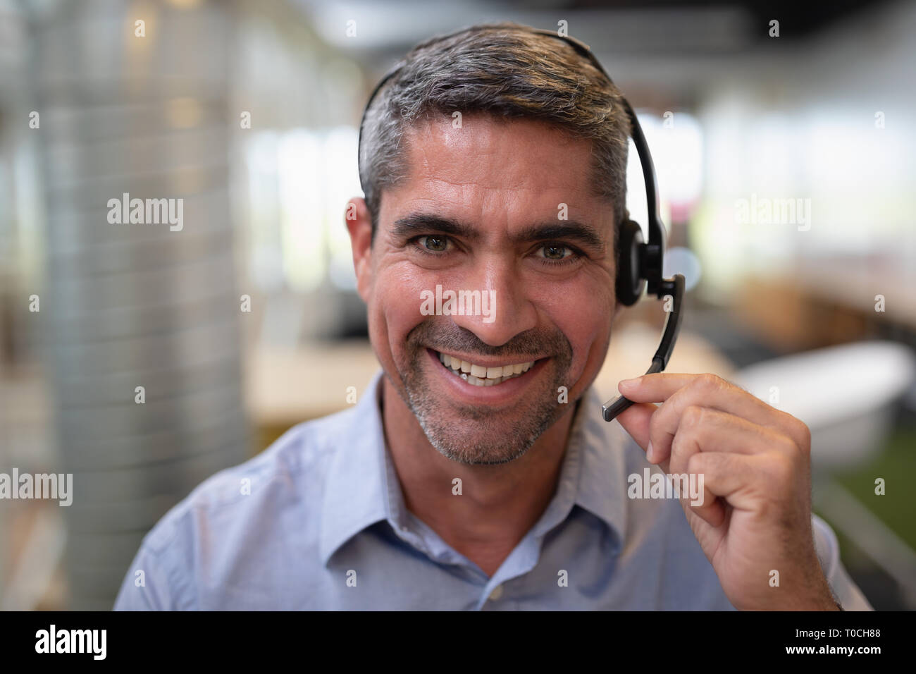 Man headphone office hi-res stock photography and images - Alamy