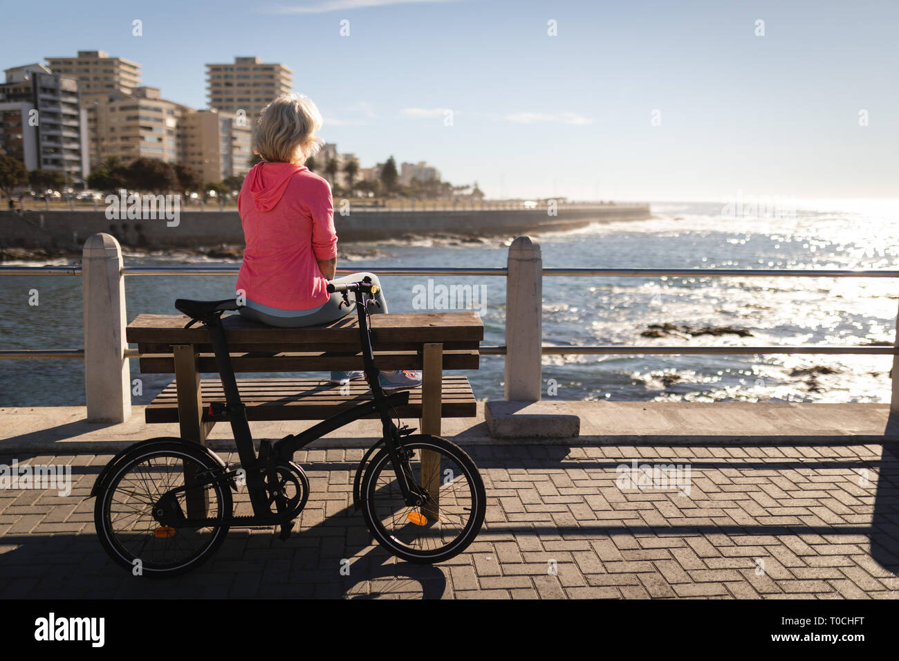 Woman relaxing on bench hi-res stock photography and images - Alamy