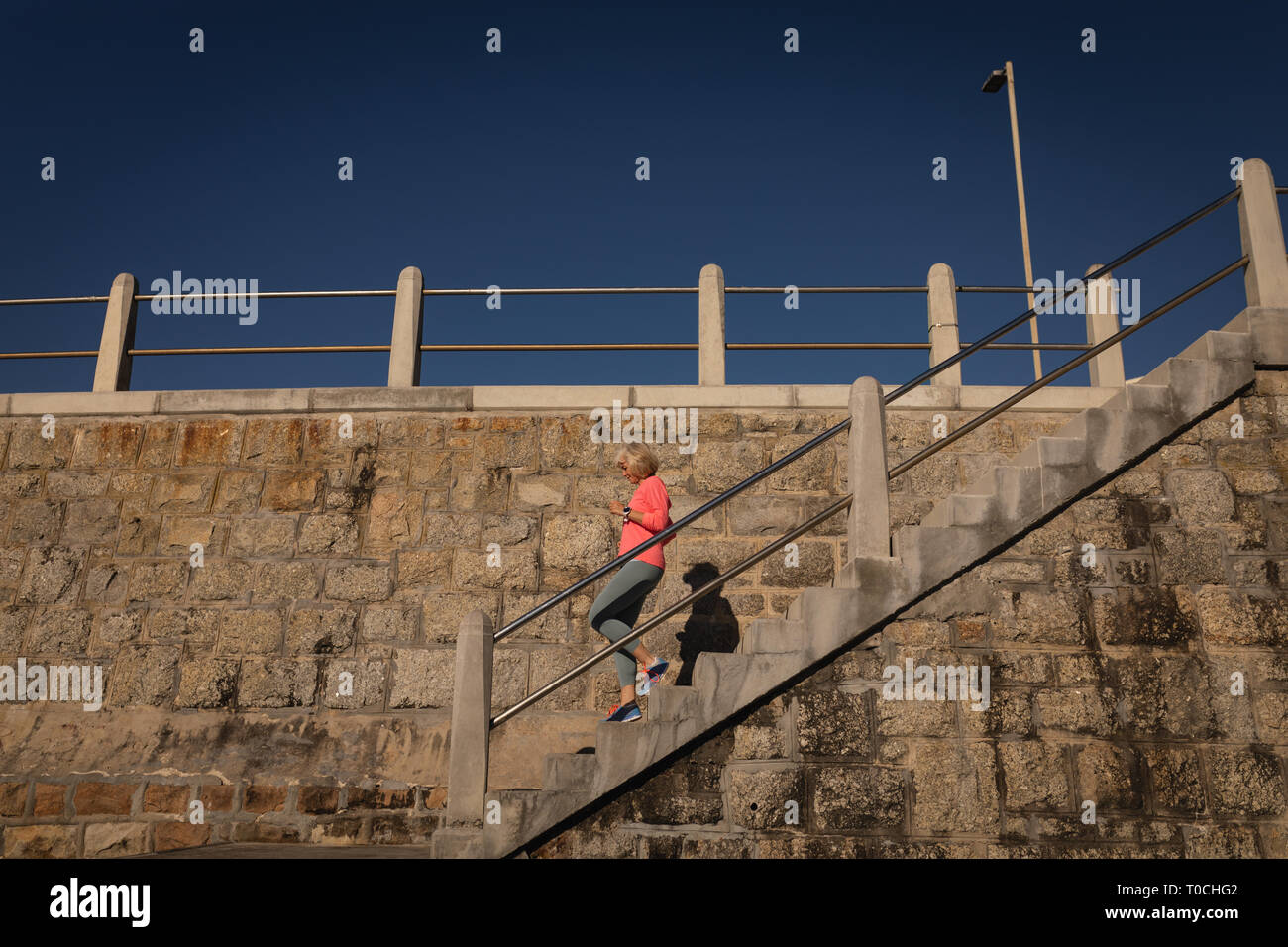 Woman downstairs hi-res stock photography and images - Alamy