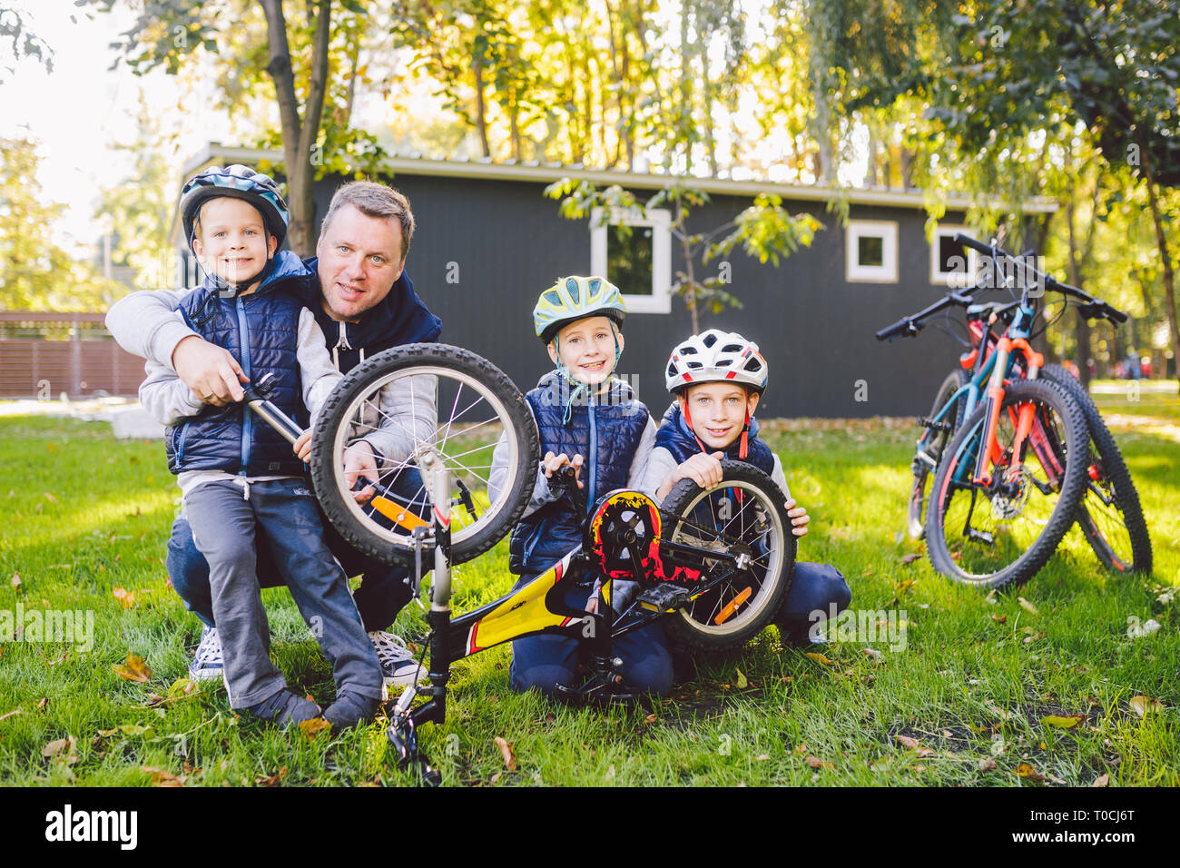 Father's day A big friendly family father and three sons joint active ...