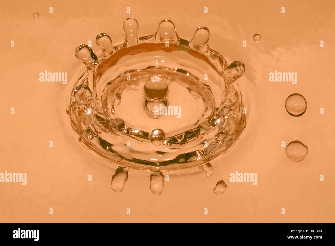 Red splash in shape of crown and falling water drop Stock Photo - Alamy