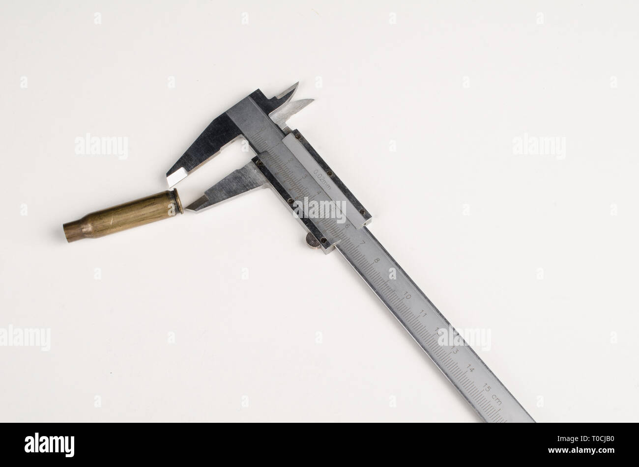 Bullet being measured with a caliper, a concept Stock Photo - Alamy