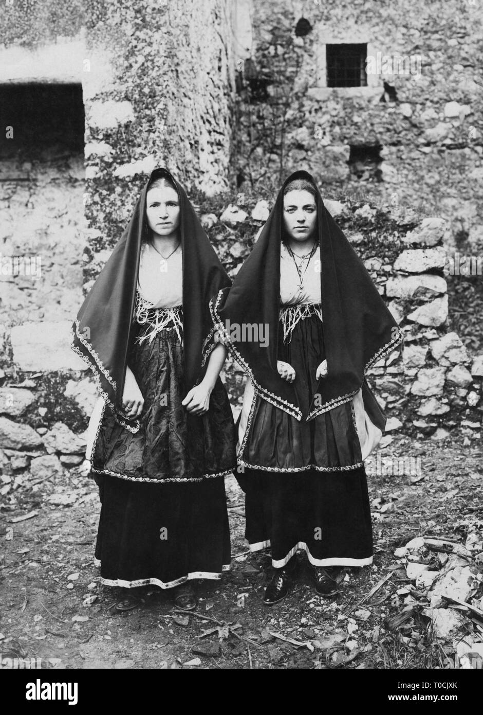 Traditional woman standing wearing Black and White Stock Photos ...