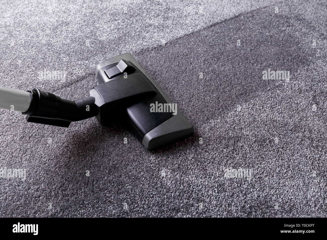 Grey carpet texture and cleaner, close up, indoors interior design ...