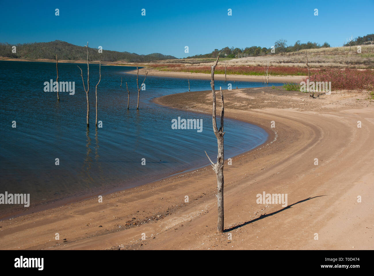 A water reservoir with a very low water level in drought conditions ...