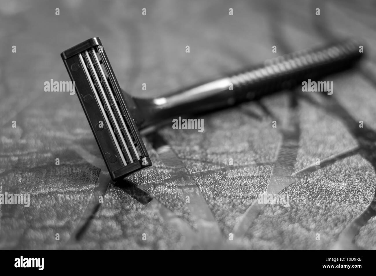 Shaving machine kept on a textured floor in black and white Stock Photo ...
