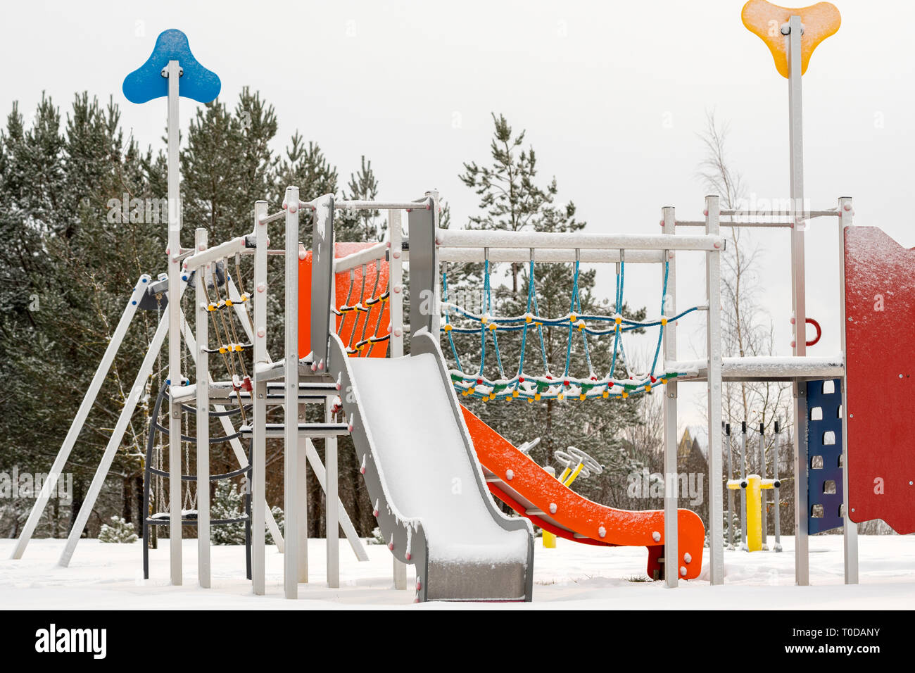 Children playground in winter after snowfall Stock Photo - Alamy