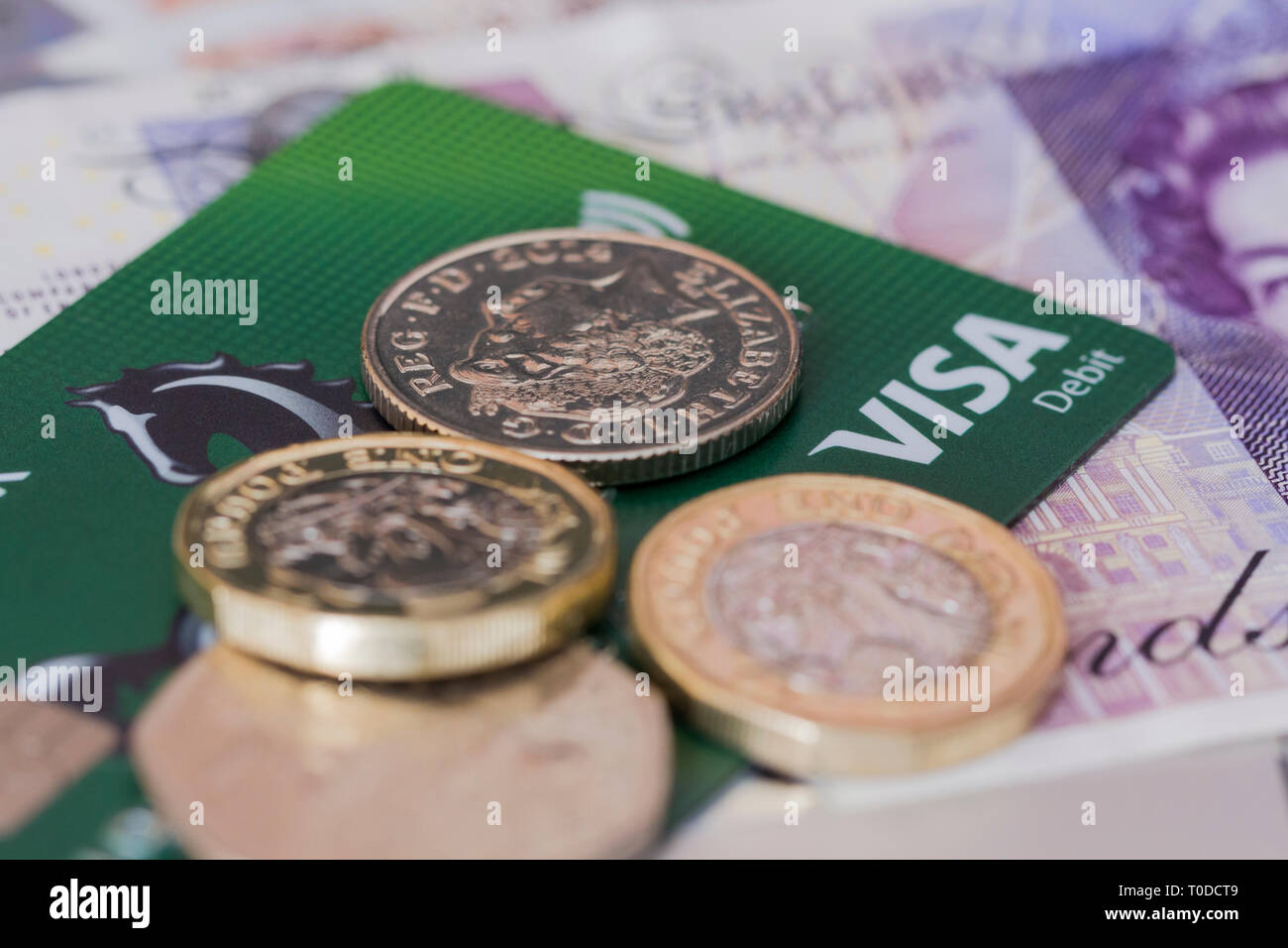 Lloyds Visa Debit card with some English sterling coins & notes. United ...