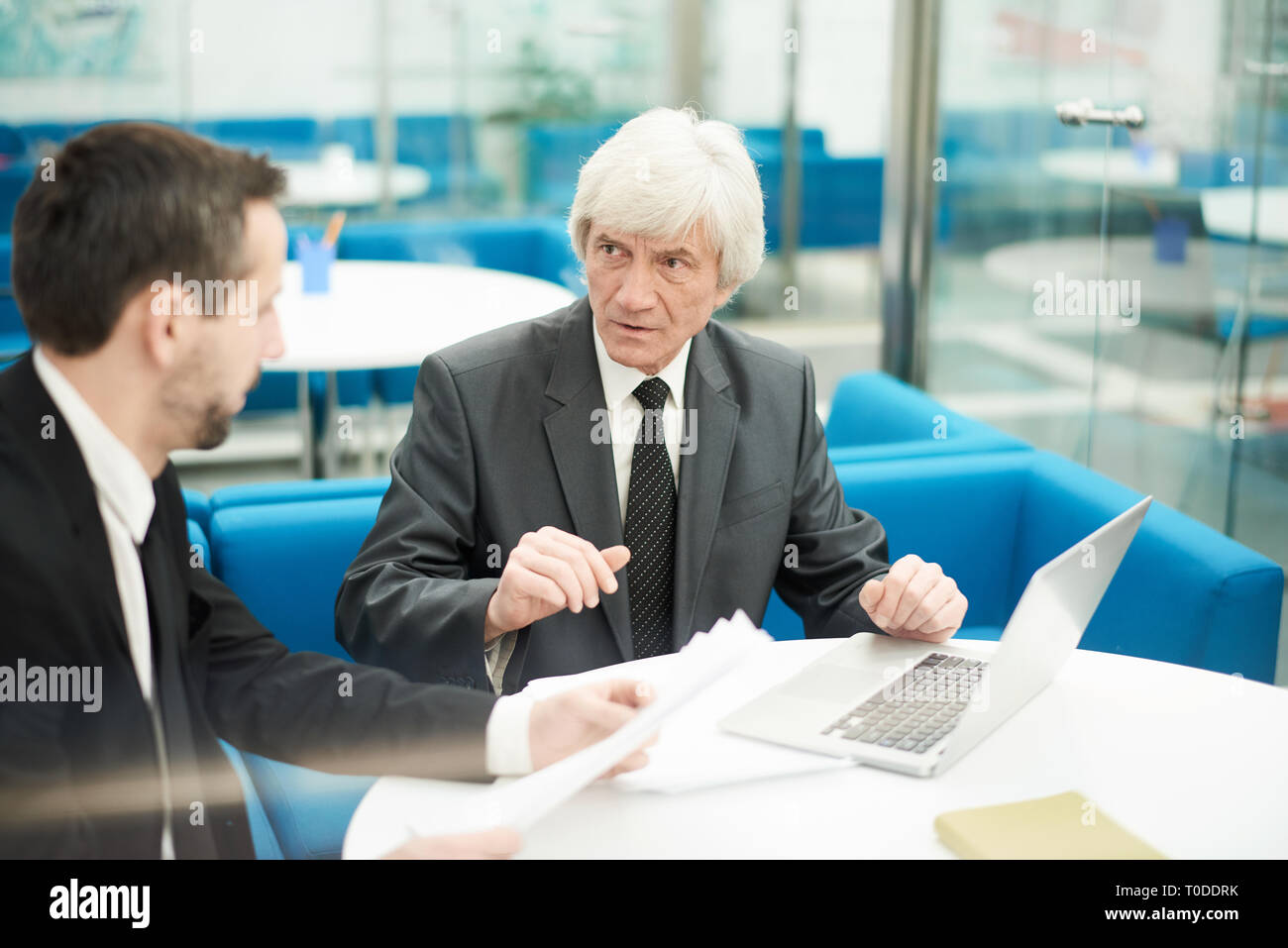 Two partners discussing contract office hi-res stock photography and ...