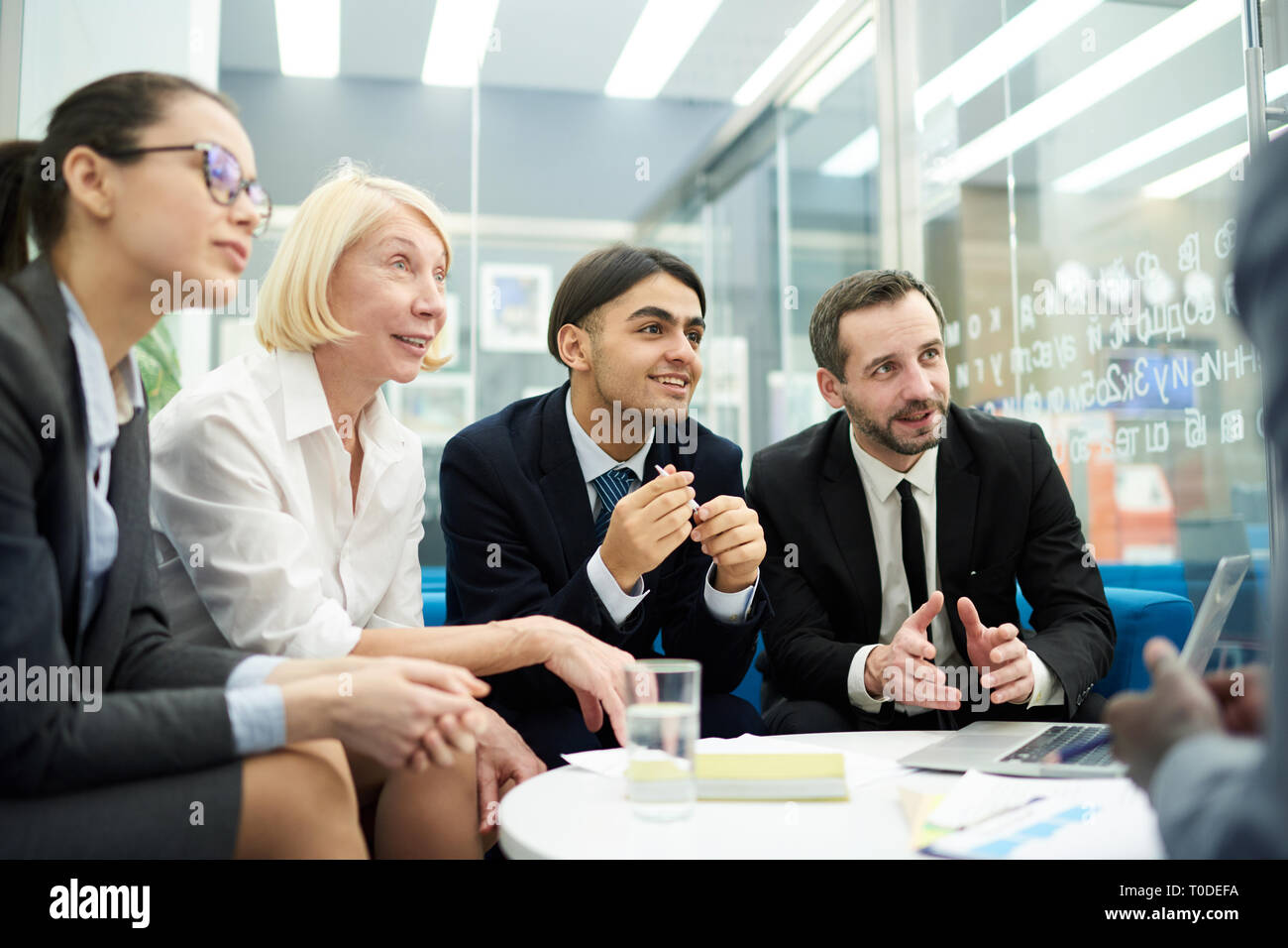 Group Discussion in Office Stock Photo - Alamy