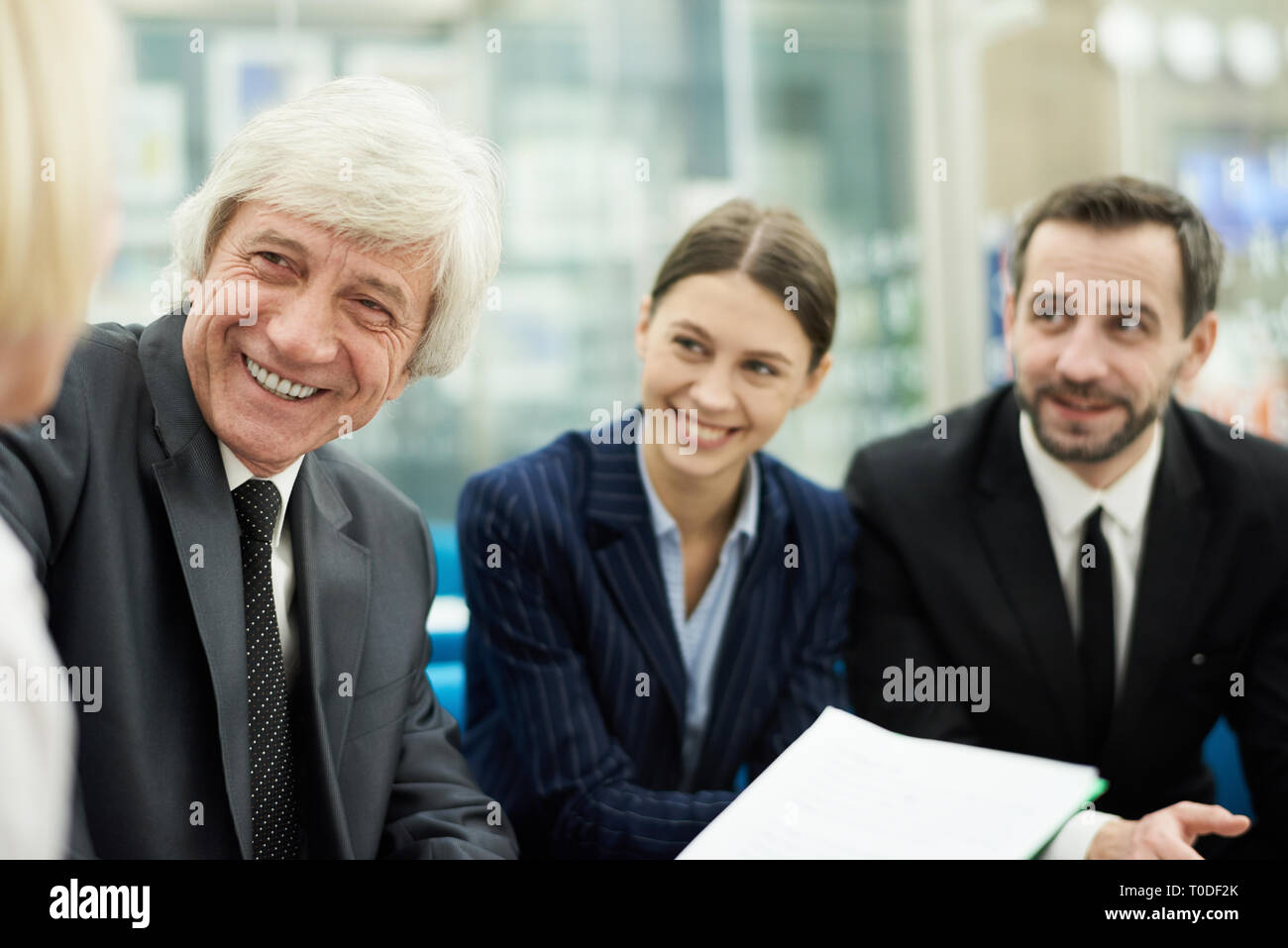 Senior Boss Meeting with Employees Stock Photo - Alamy