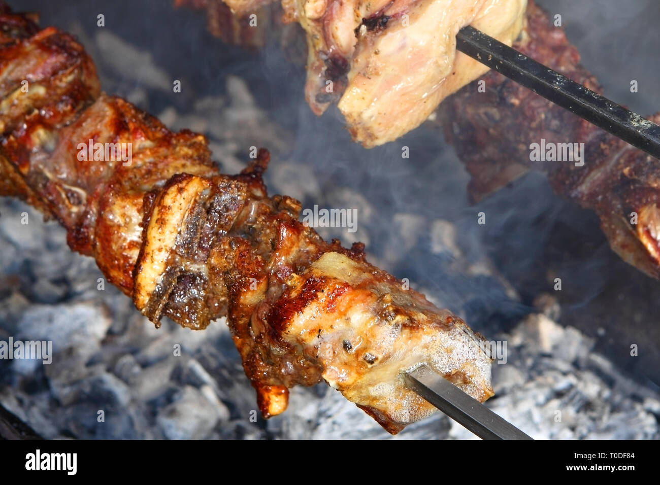 Juicy meat cooking on rotisserie, traditional Cyprus Souvla Stock Photo ...