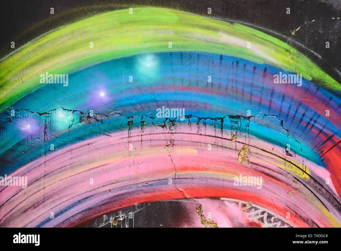 Detail of an anonymous street graffiti with many colors, cheerful urban ...