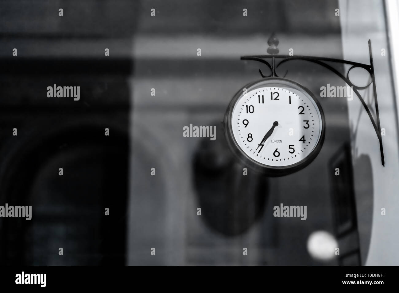 Old city street clock on a gray background with copy space for your ...