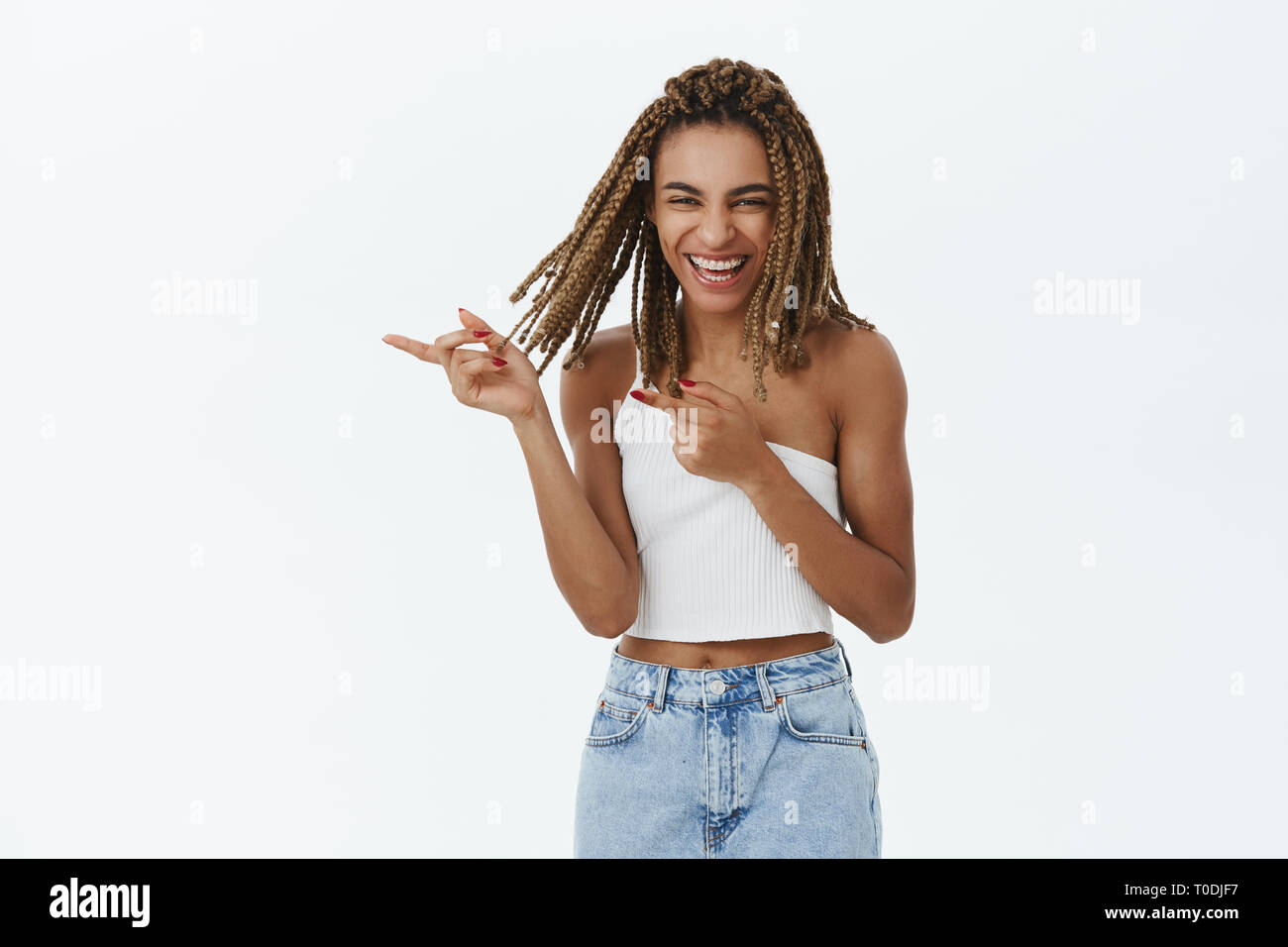 Girl spending time in hilarious company. Joyful attractive and carefree ...
