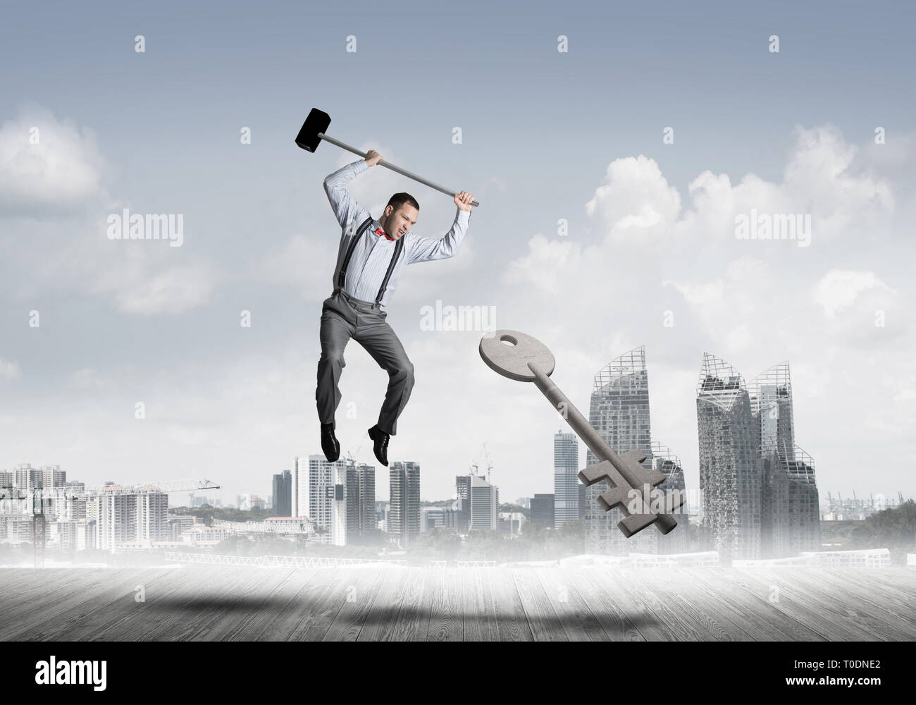 Breaking through access concept with man in anger crashing concrete key ...