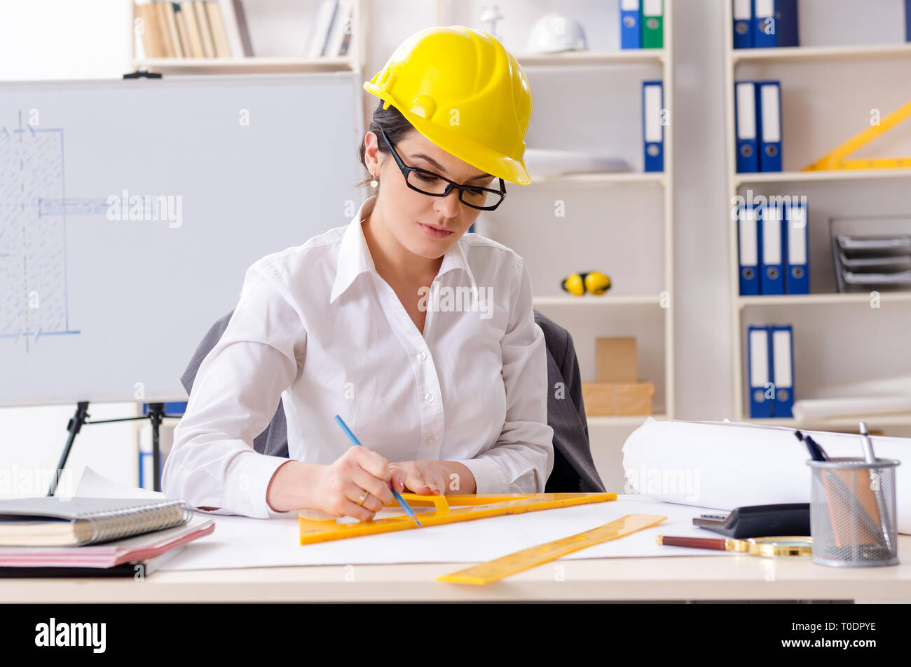 Female architect working in the office Stock Photo - Alamy