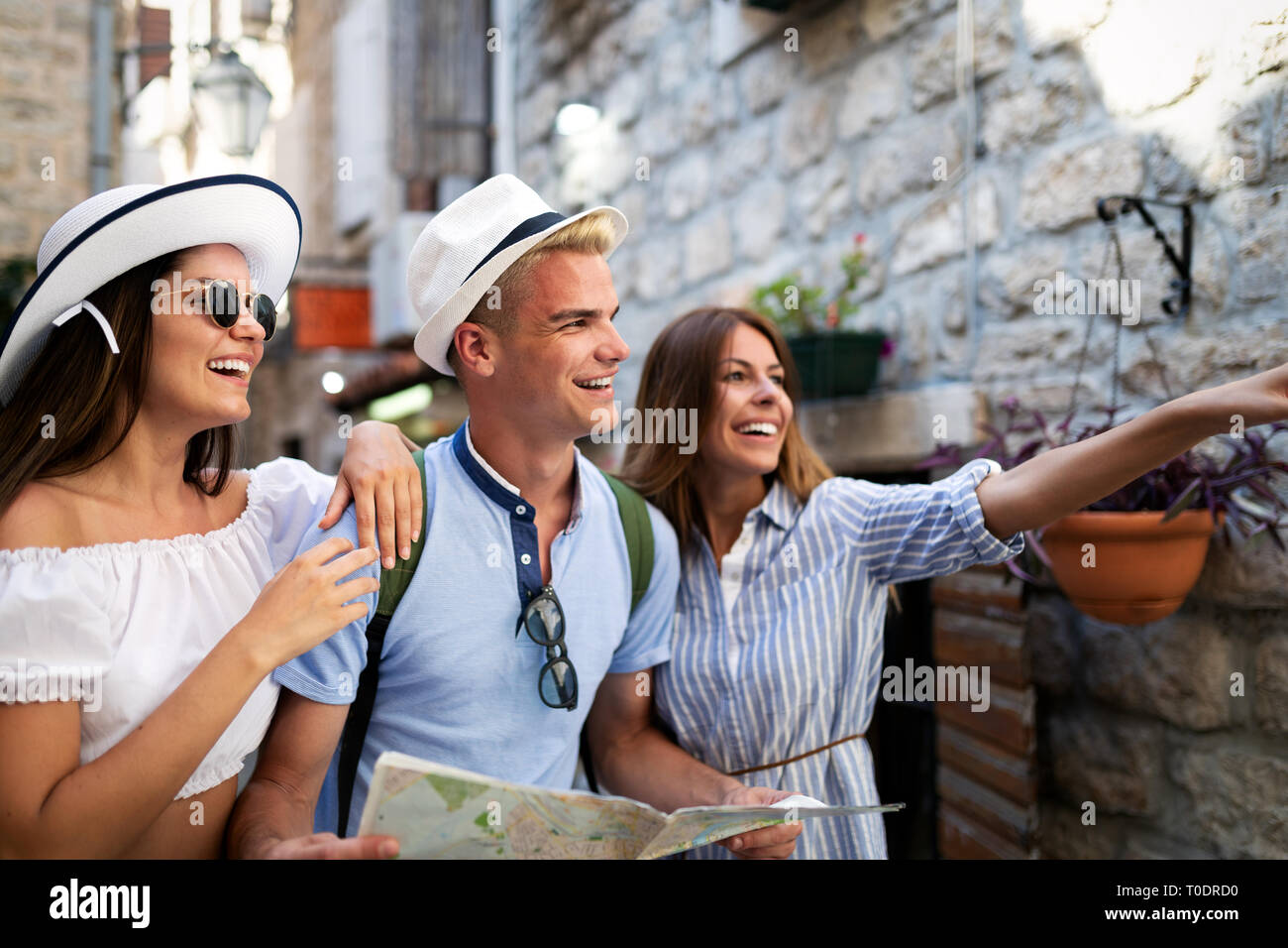 Happy group of friends enjoying traveling and vacation Stock Photo - Alamy