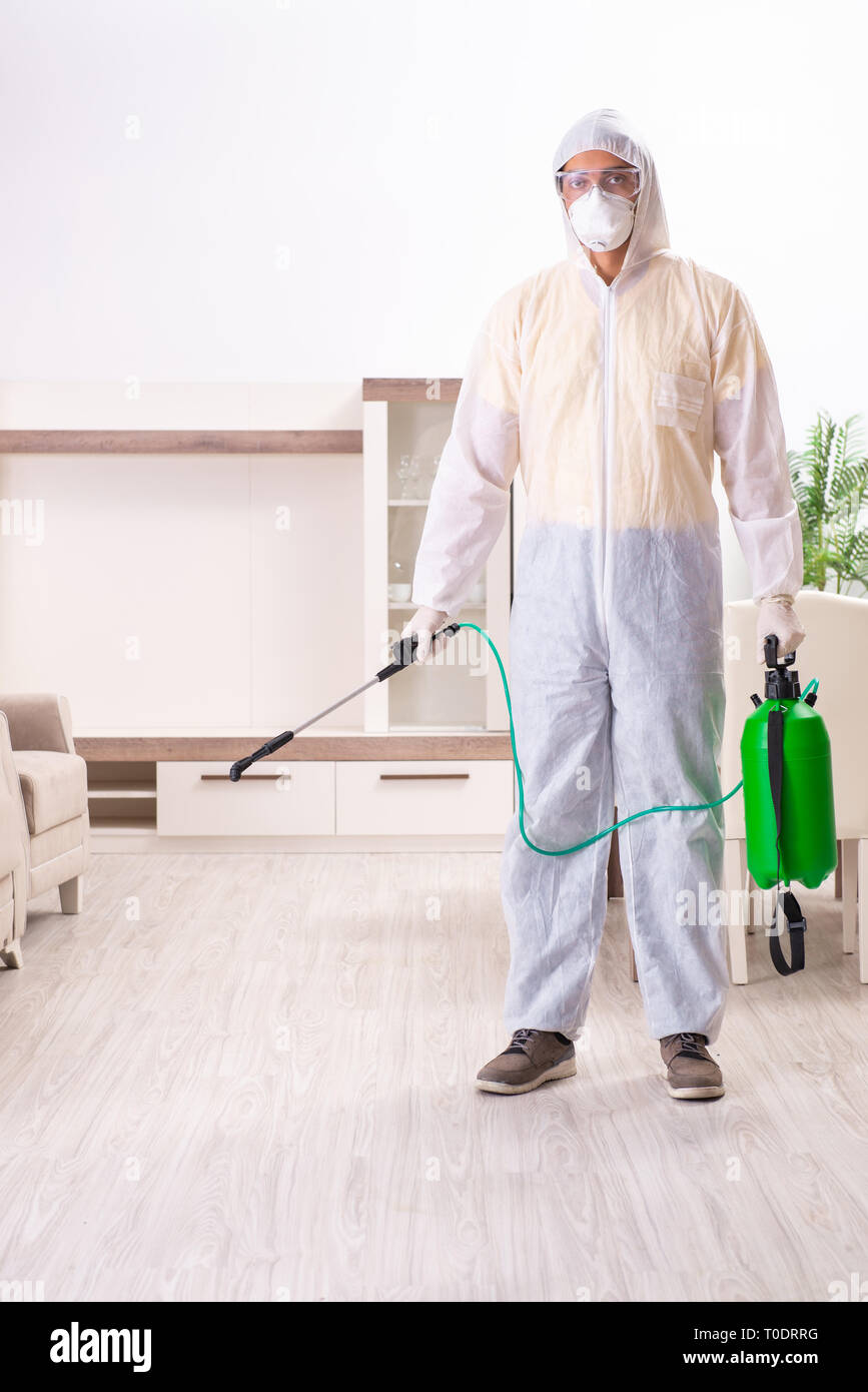 Pest control contractor working in the flat Stock Photo - Alamy