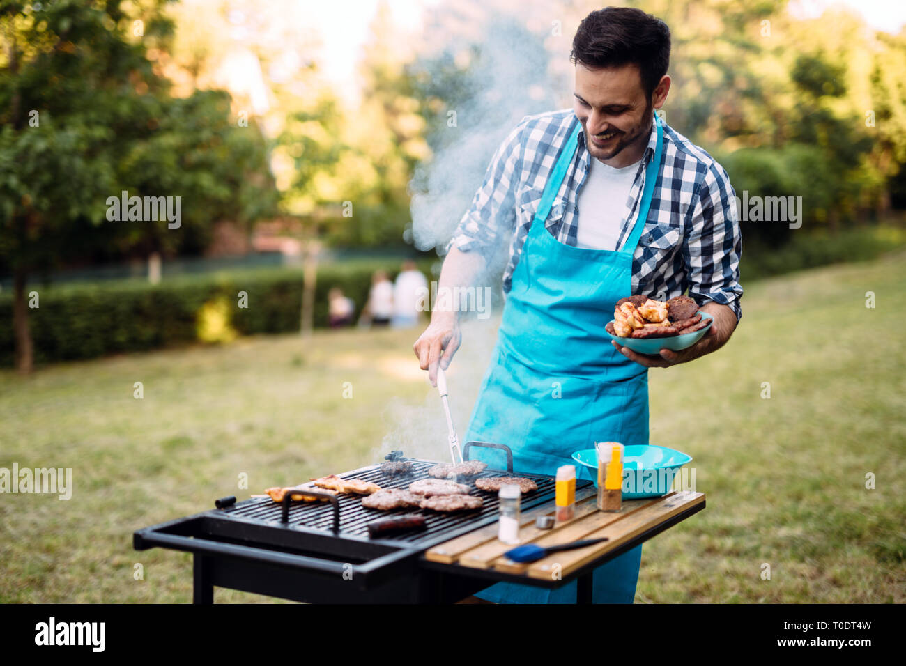Preparing bbq meal hi-res stock photography and images - Alamy