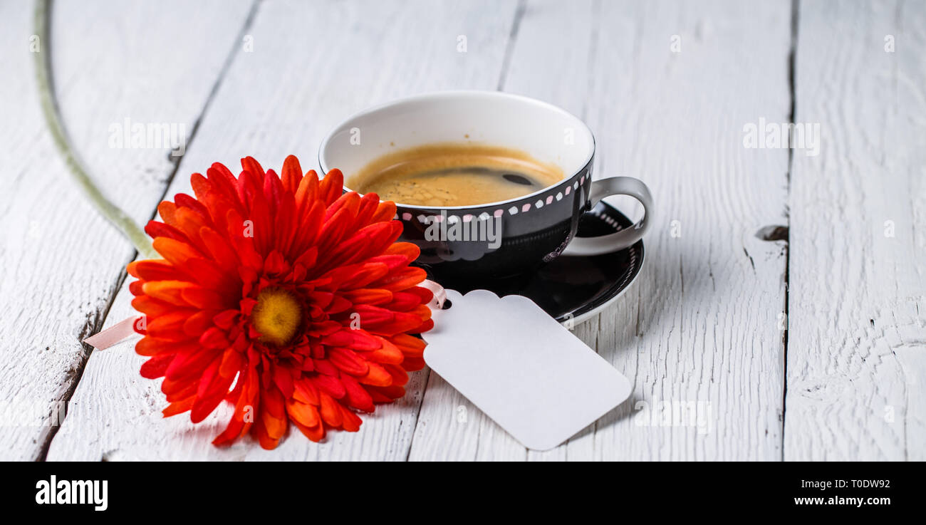 Red flower, cup and card Stock Photo - Alamy