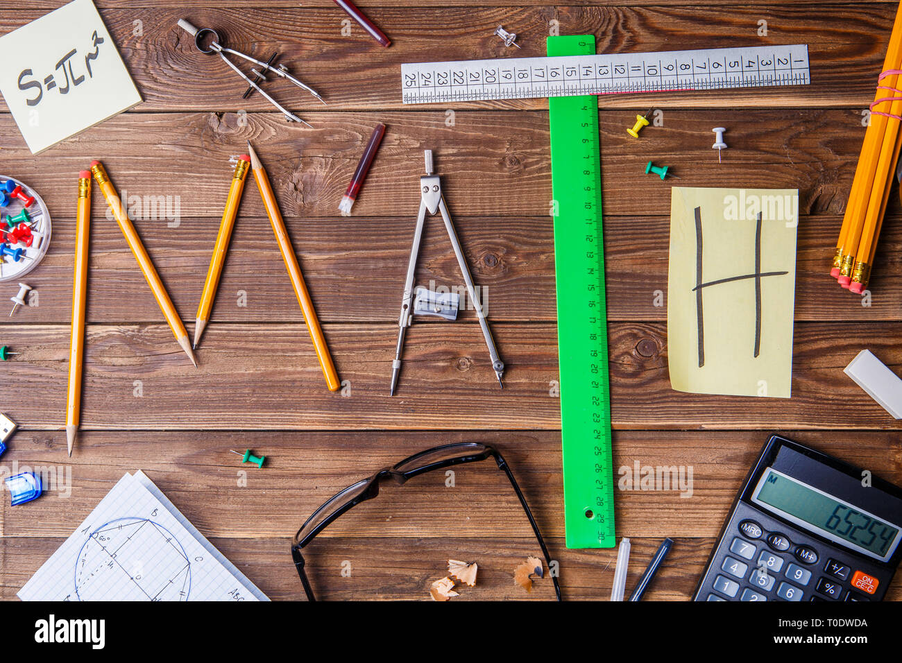 Text math composed of pencils, rulers, circular, sharpener and sticker ...