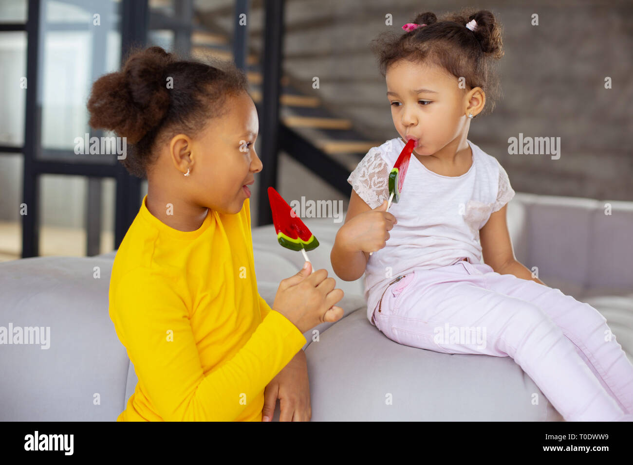 Beautiful international kid sitting in semi position Stock Photo - Alamy