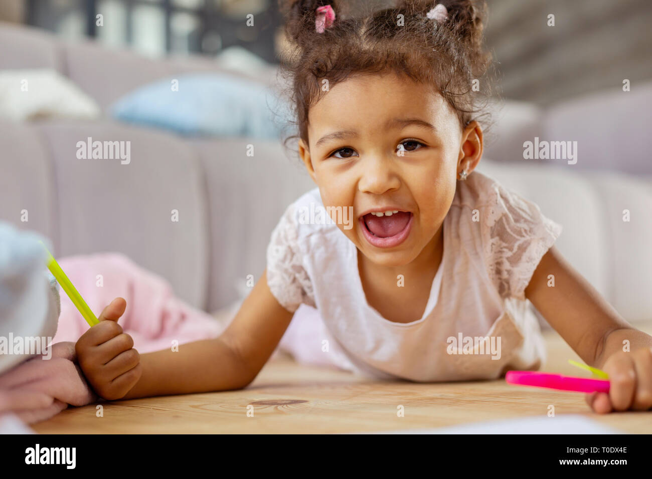 Positive delighted child demonstrating her friendly smile Stock Photo ...