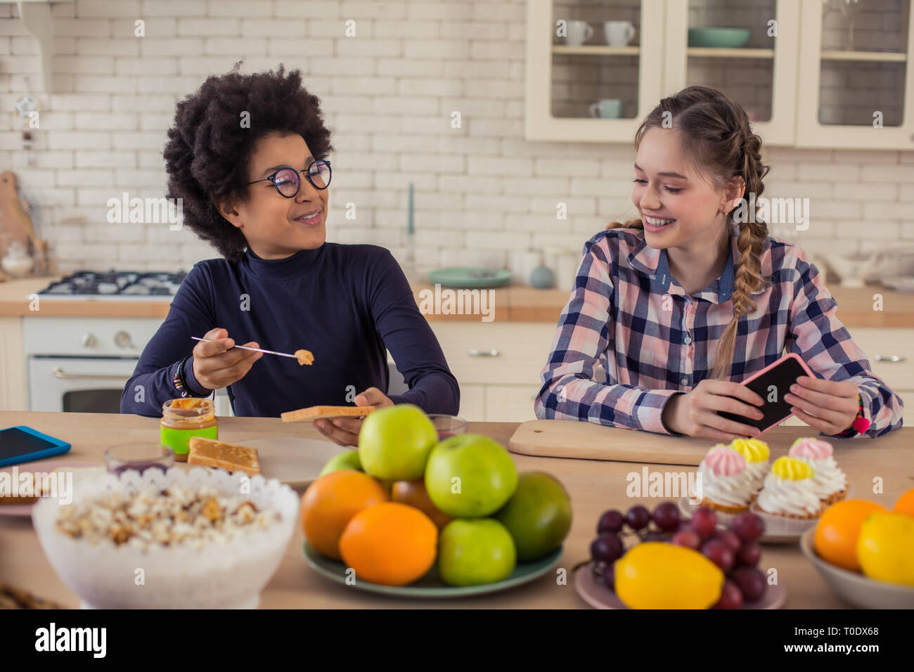 Kind boy having pleasant conversation with his classmate Stock Photo ...